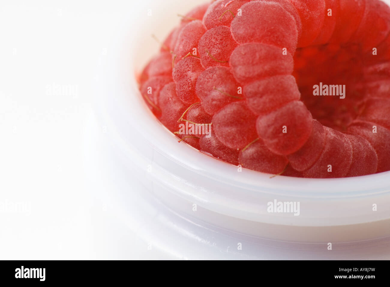 Raspberry in small container, extreme close-up Stock Photo - Alamy