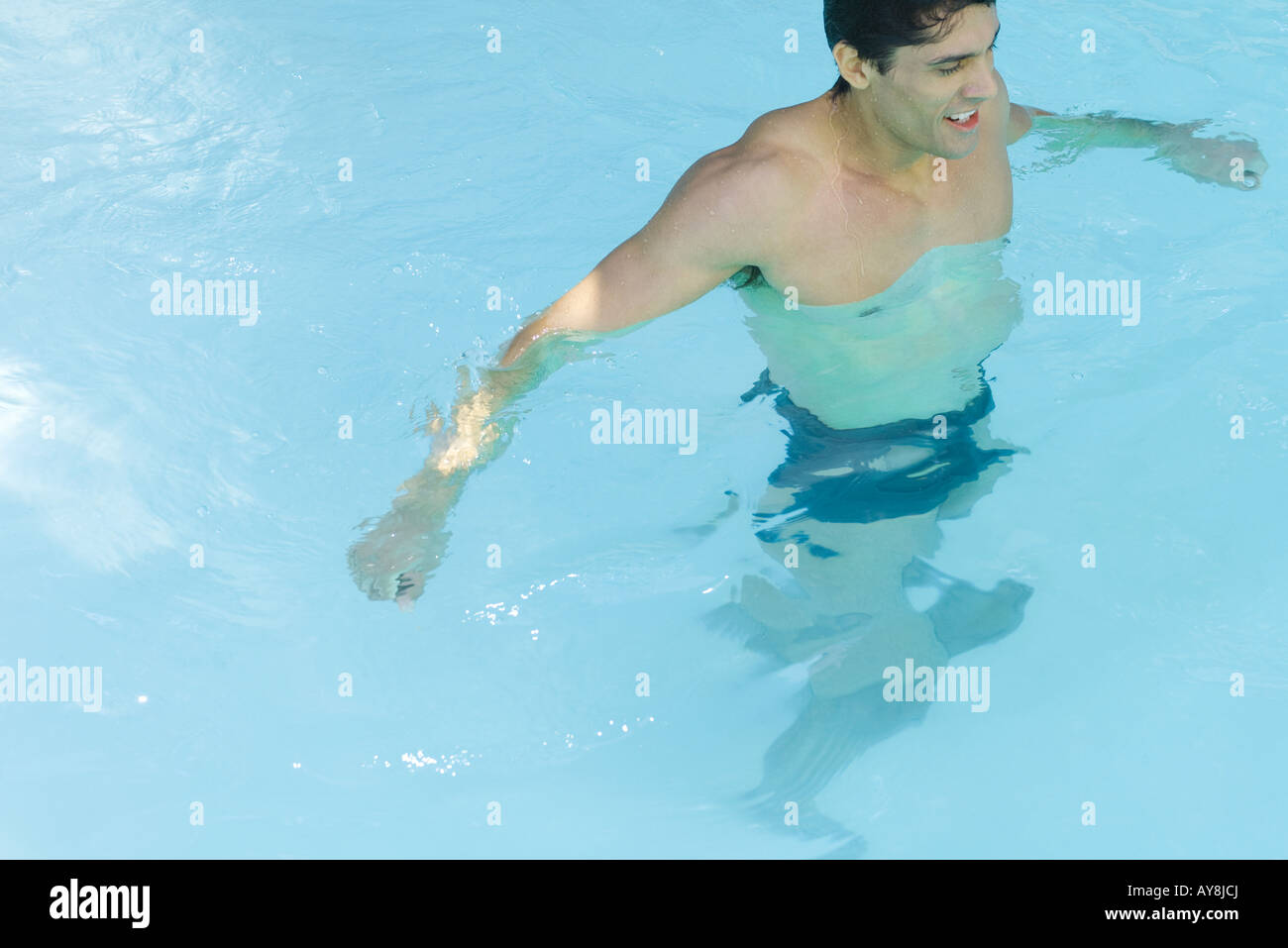 Man standing in swimming pool, high angle view Stock Photo - Alamy