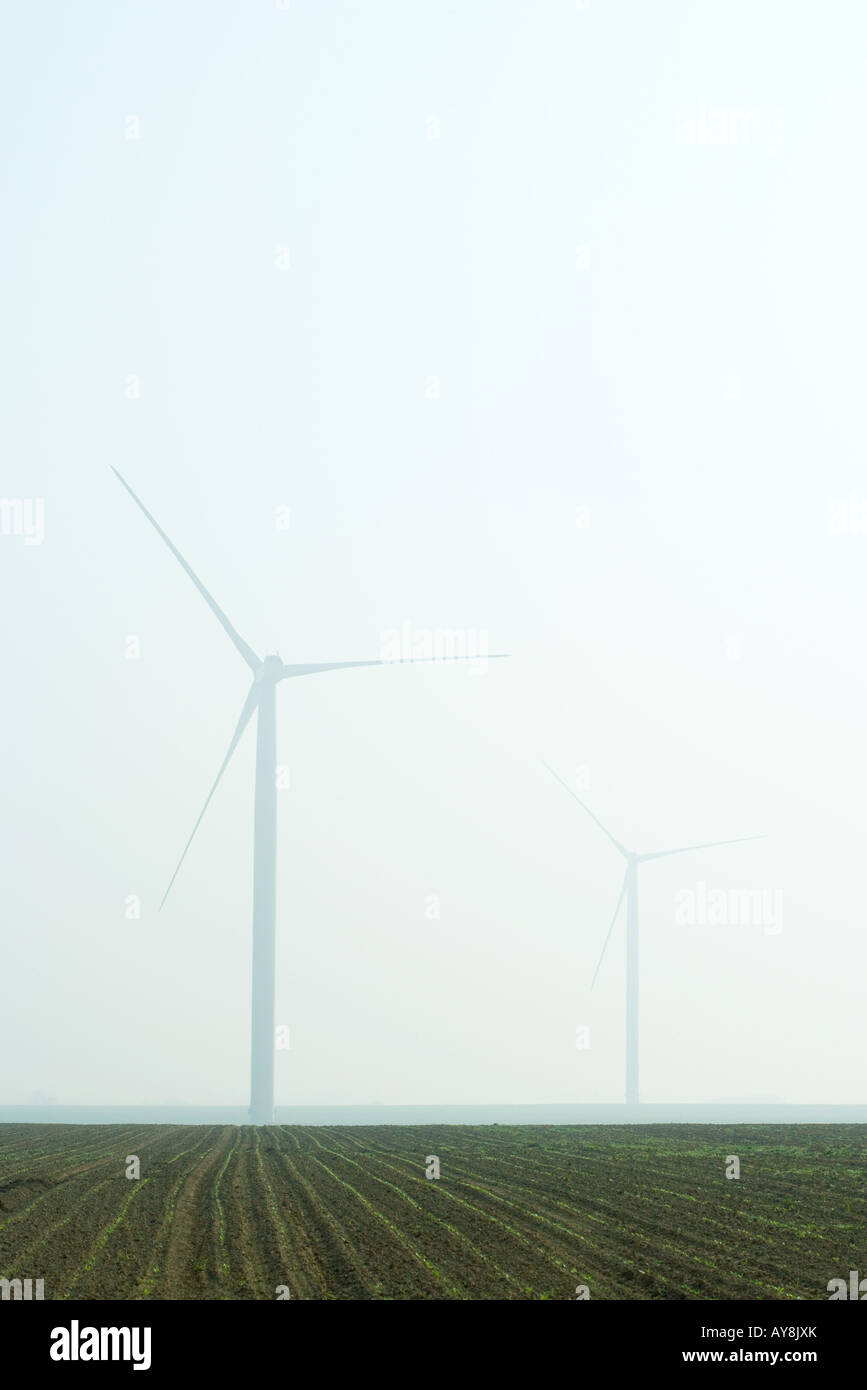 Two wind turbines in fog hi-res stock photography and images - Alamy