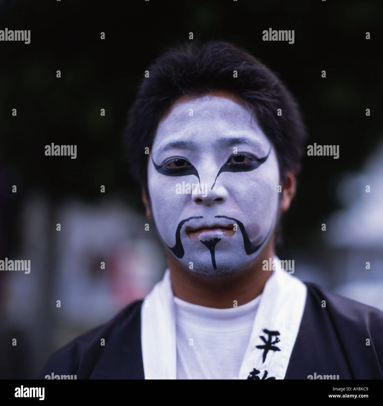 Man in face paint and yukata at traditional Okinawan Eisa festival at ...