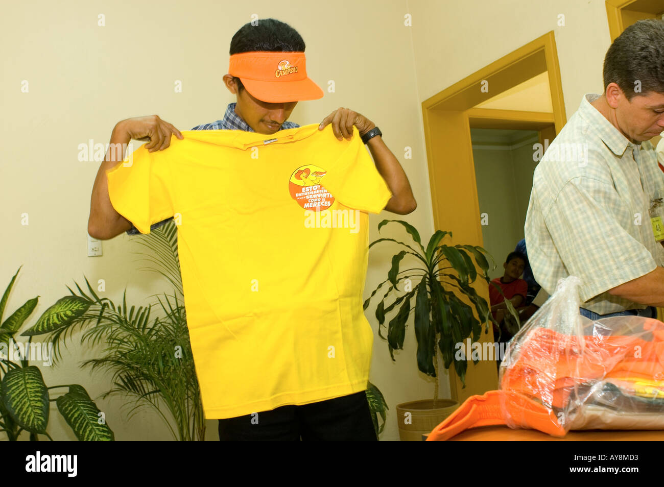 New employes try on uniforms on their first day of work at Pollo ...