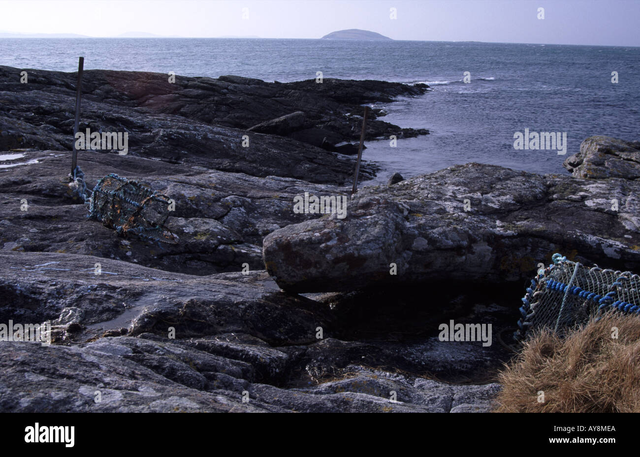Rocky shoreline of the Isle of Eriskay in the Outer Hebrides or Western ...