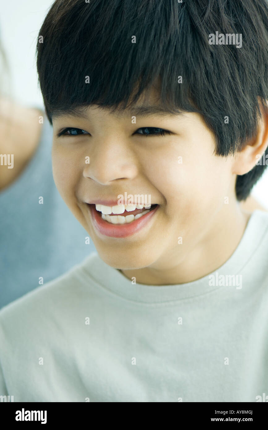 Boy smiling, looking away, close-up Stock Photo - Alamy