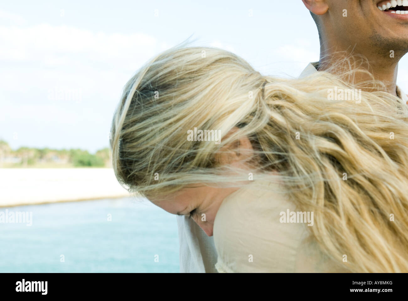 Couple laughing together, cropped view Stock Photo - Alamy