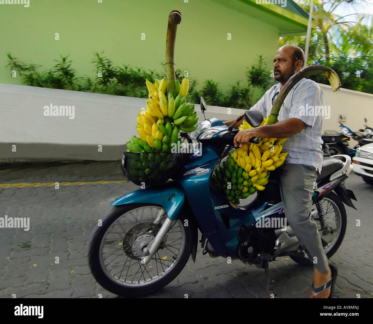 a man carries banana on motorcycle Stock Photo - Alamy