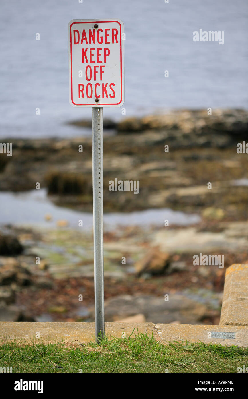 Danger keep off rocks, sign Stock Photo - Alamy