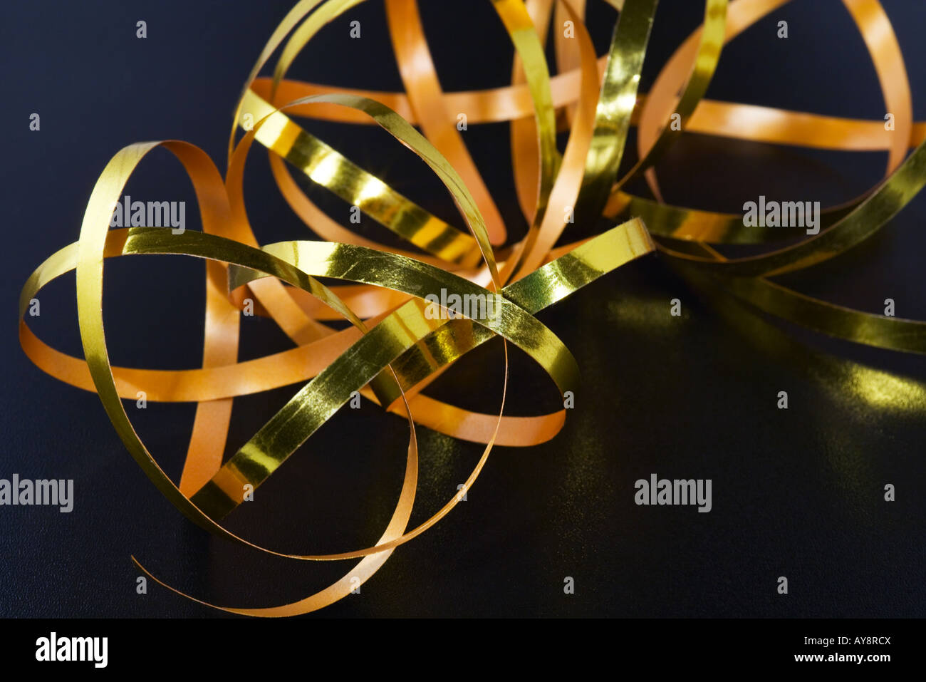 Gold-colored gift-wrap ribbon, close-up Stock Photo - Alamy
