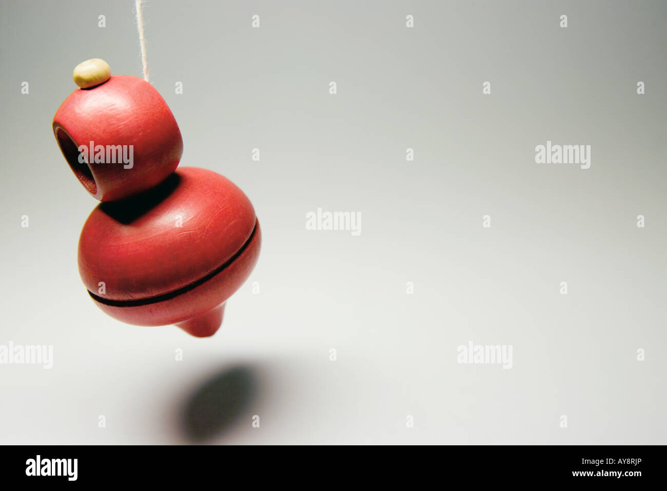 Spinning string tops hi-res stock photography and images - Alamy