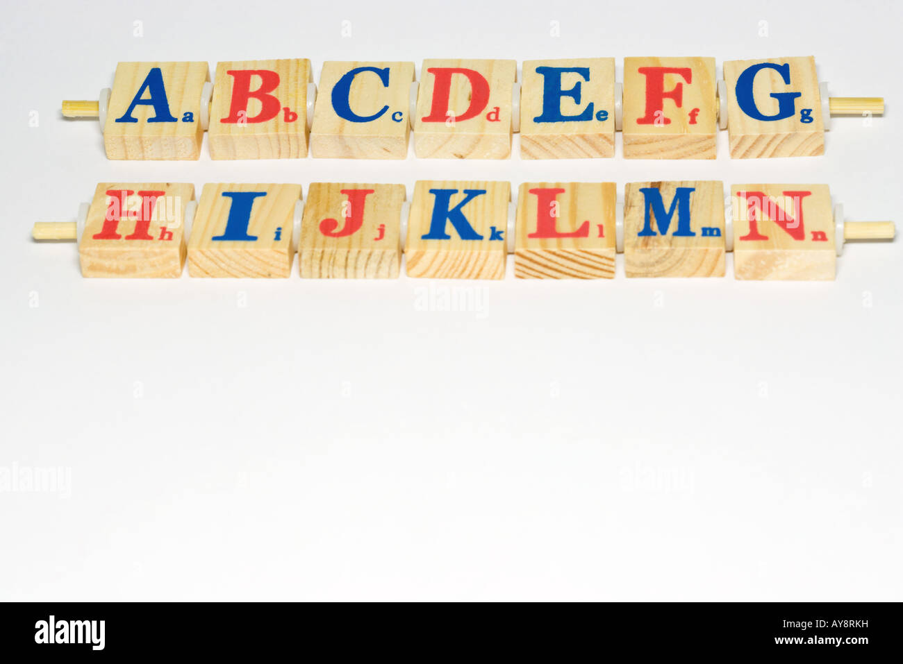 Wooden alphabet blocks lined up, close-up Stock Photo - Alamy