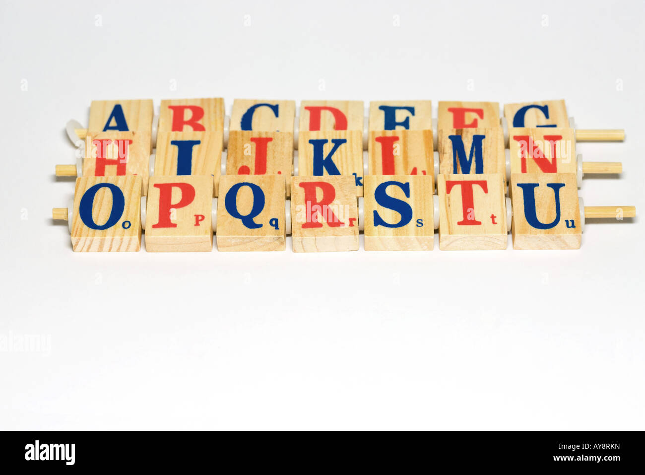 Wooden alphabet blocks lined up, close-up Stock Photo - Alamy