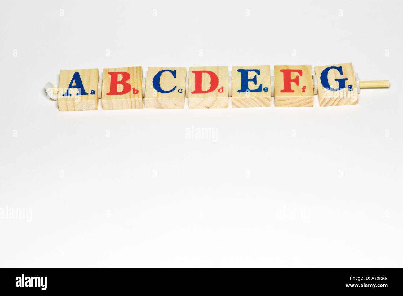 Wooden alphabet blocks lined up, close-up Stock Photo - Alamy