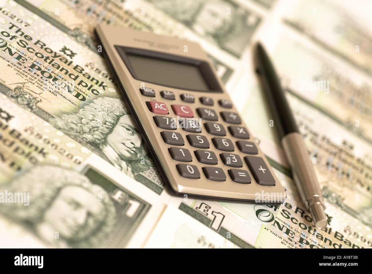 Calculator and money Stock Photo - Alamy