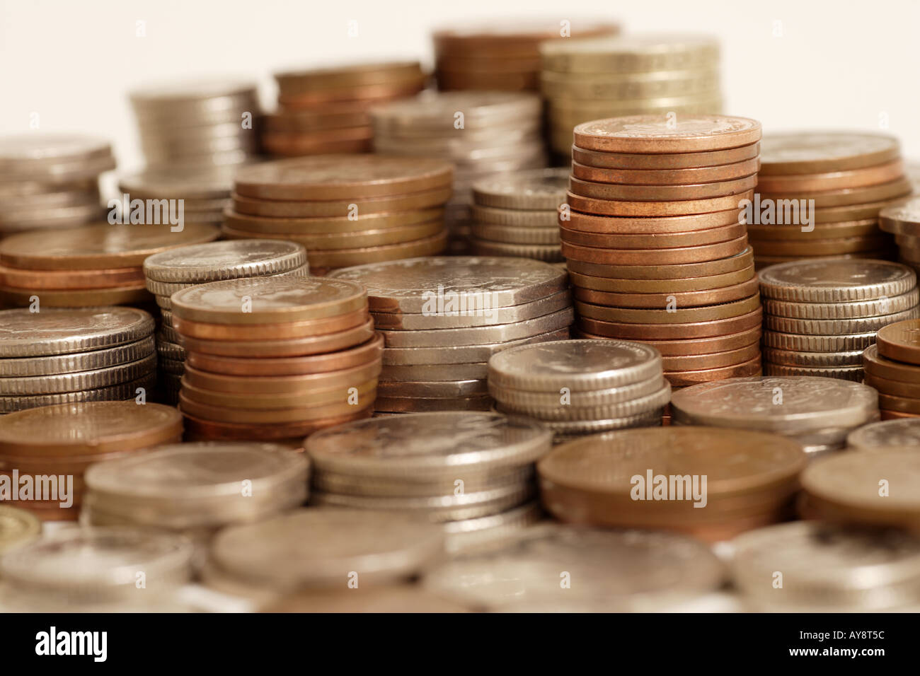 Piles of coins Stock Photo - Alamy