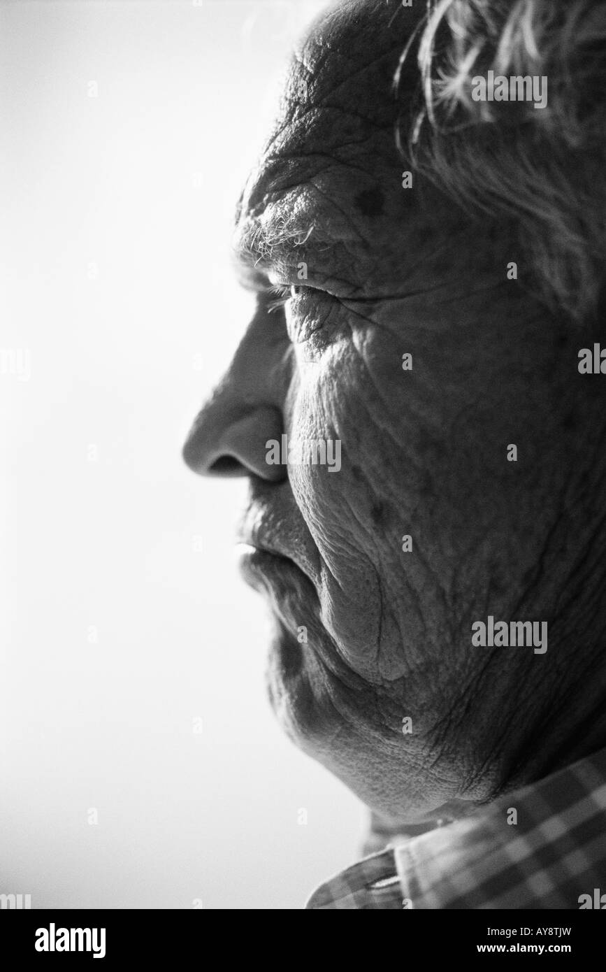 Man frowning, profile, portrait Stock Photo - Alamy