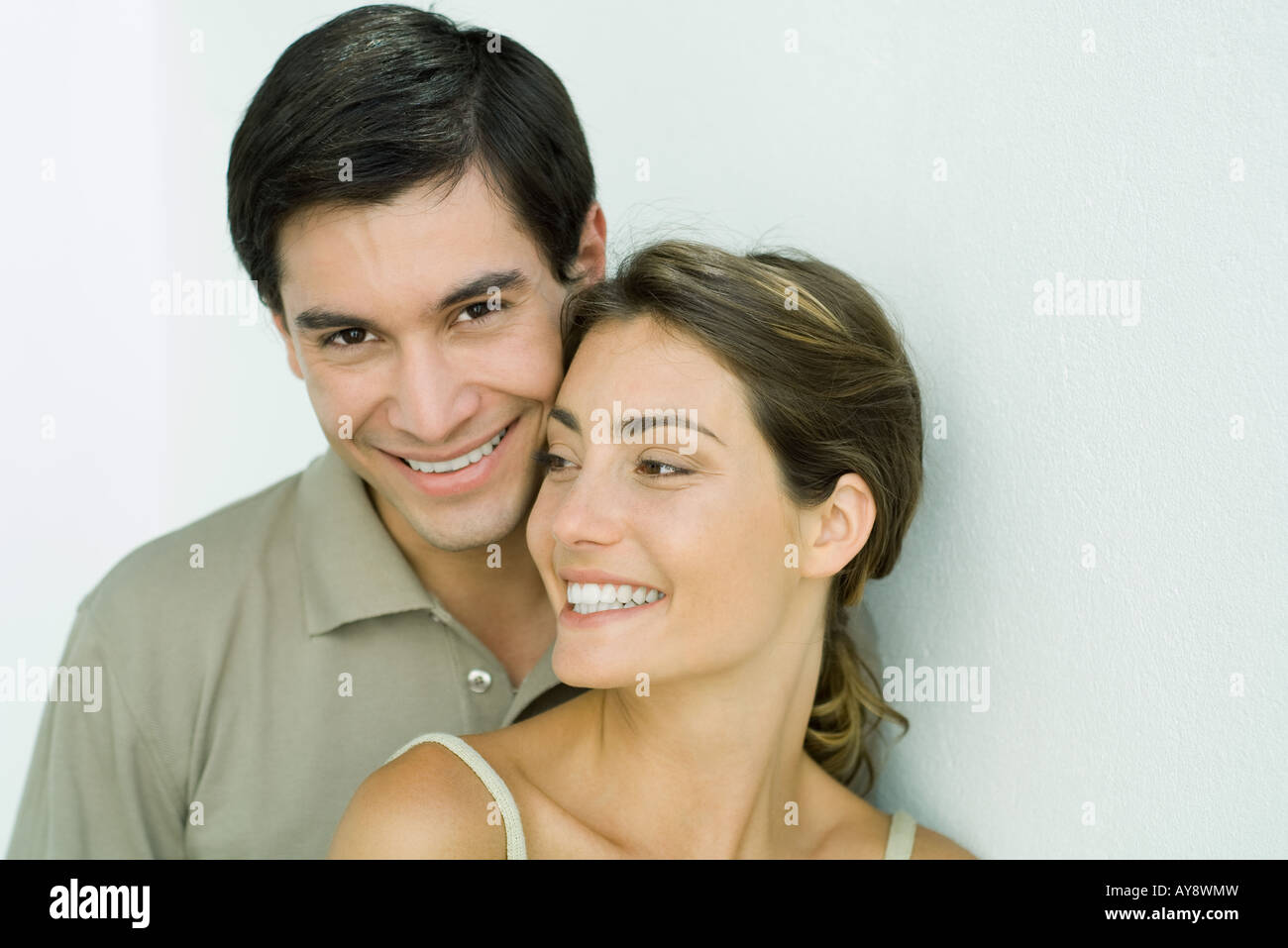 Young couple smiling, cheek to cheek, portrait Stock Photo - Alamy