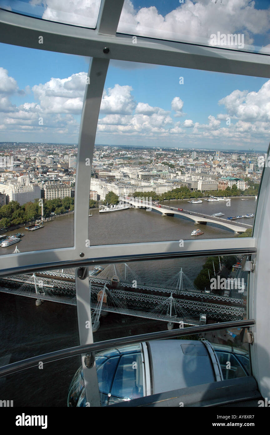 Inside a capsule of London Eye in London, UK. View on Hungerford Bridge ...