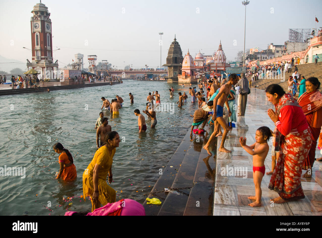 People bathing and making puja on Ganga Ghat in Haridwar in India Stock ...