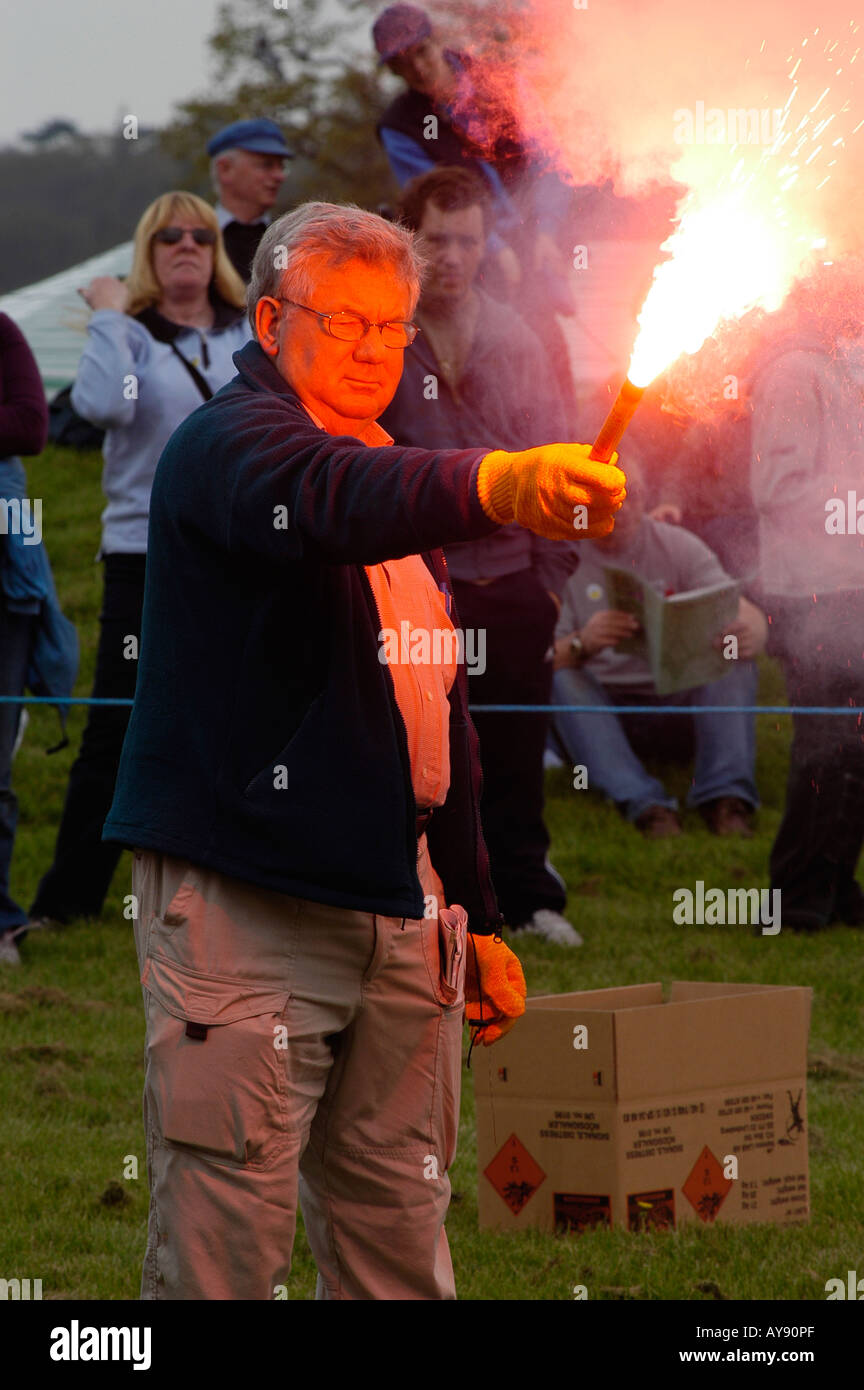 Man demonstrating a distress flare Stock Photo - Alamy
