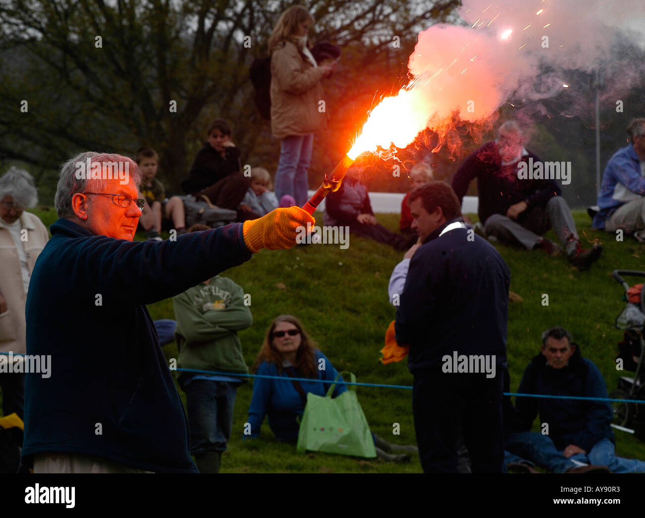 Man demonstrating a distress flare Stock Photo - Alamy