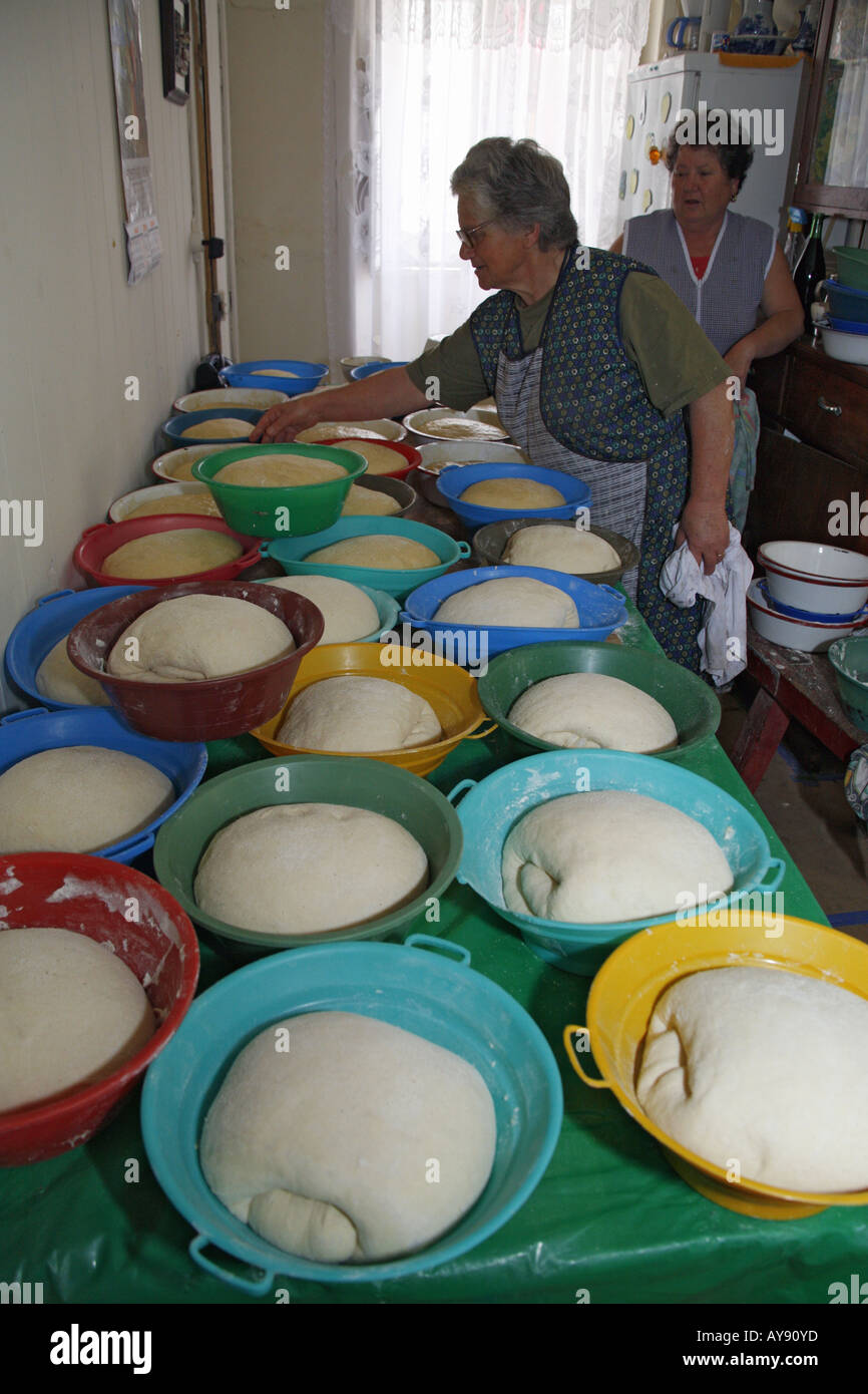 Women preparing the bread and the traditional "massa sovada". Azores ...
