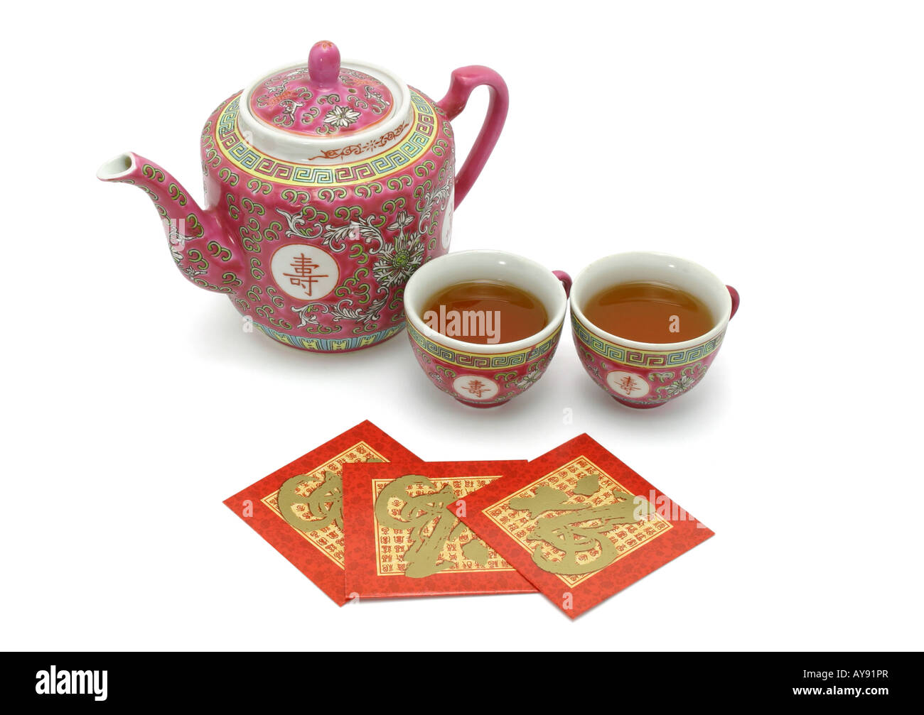 Chinese longevity tea set and red packets for tea ceremony on white ...
