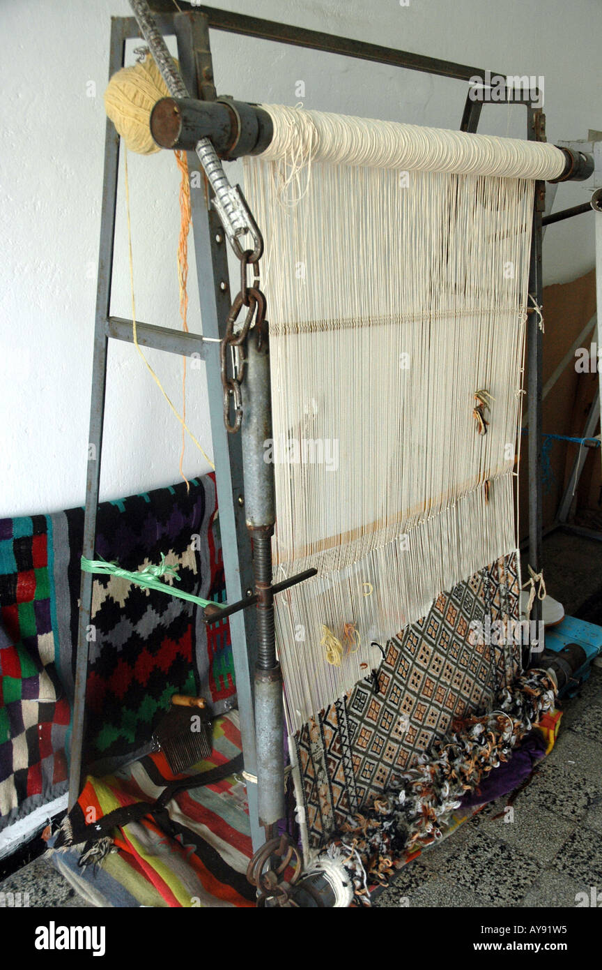 Machine to making carpets inside the carpet manufacture shop in ...