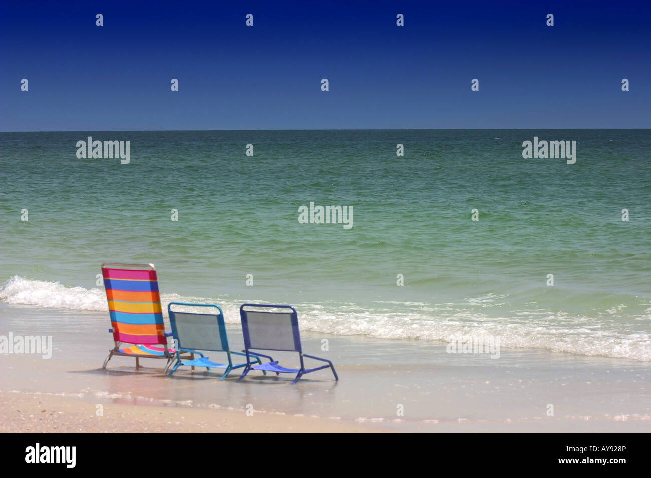 Three Beach Chairs at the oceans edge Florida s Gulf Coast Stock Photo ...