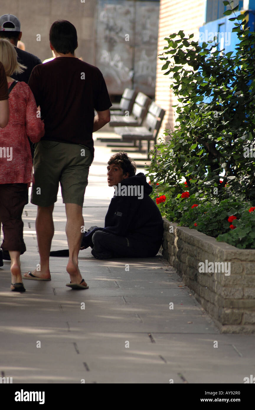 beggar sitting on a sidewalk in London, UK Stock Photo - Alamy
