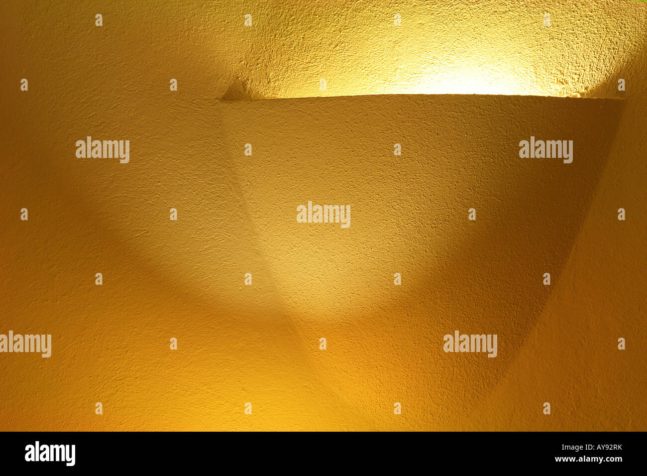 Wall with yellow light Stock Photo - Alamy