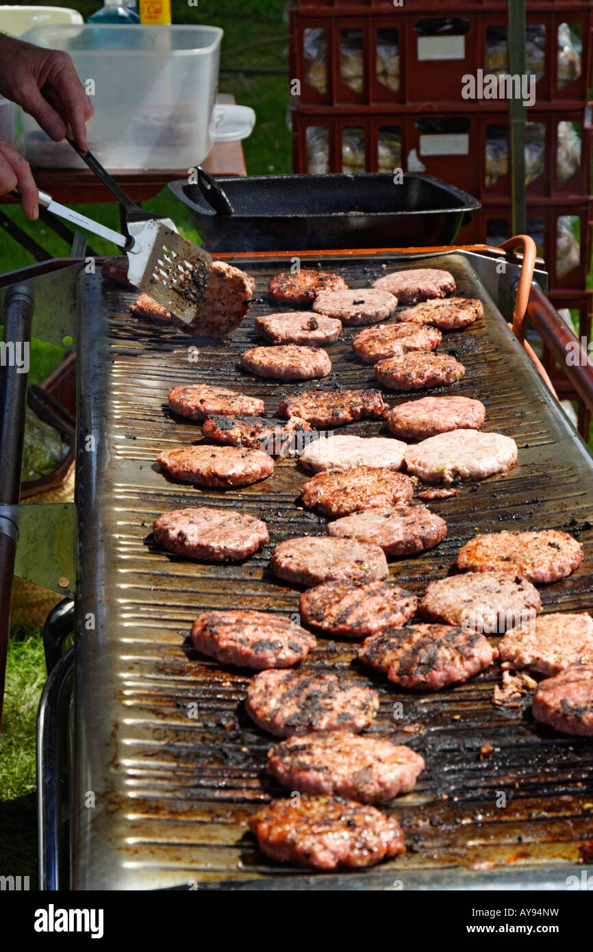 Man flipping burgers hi-res stock photography and images - Alamy