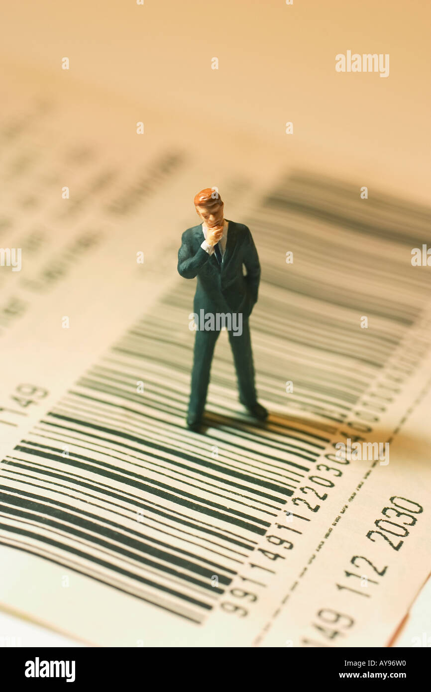 Businessman Figures Standing on Barcode Stock Photo - Alamy