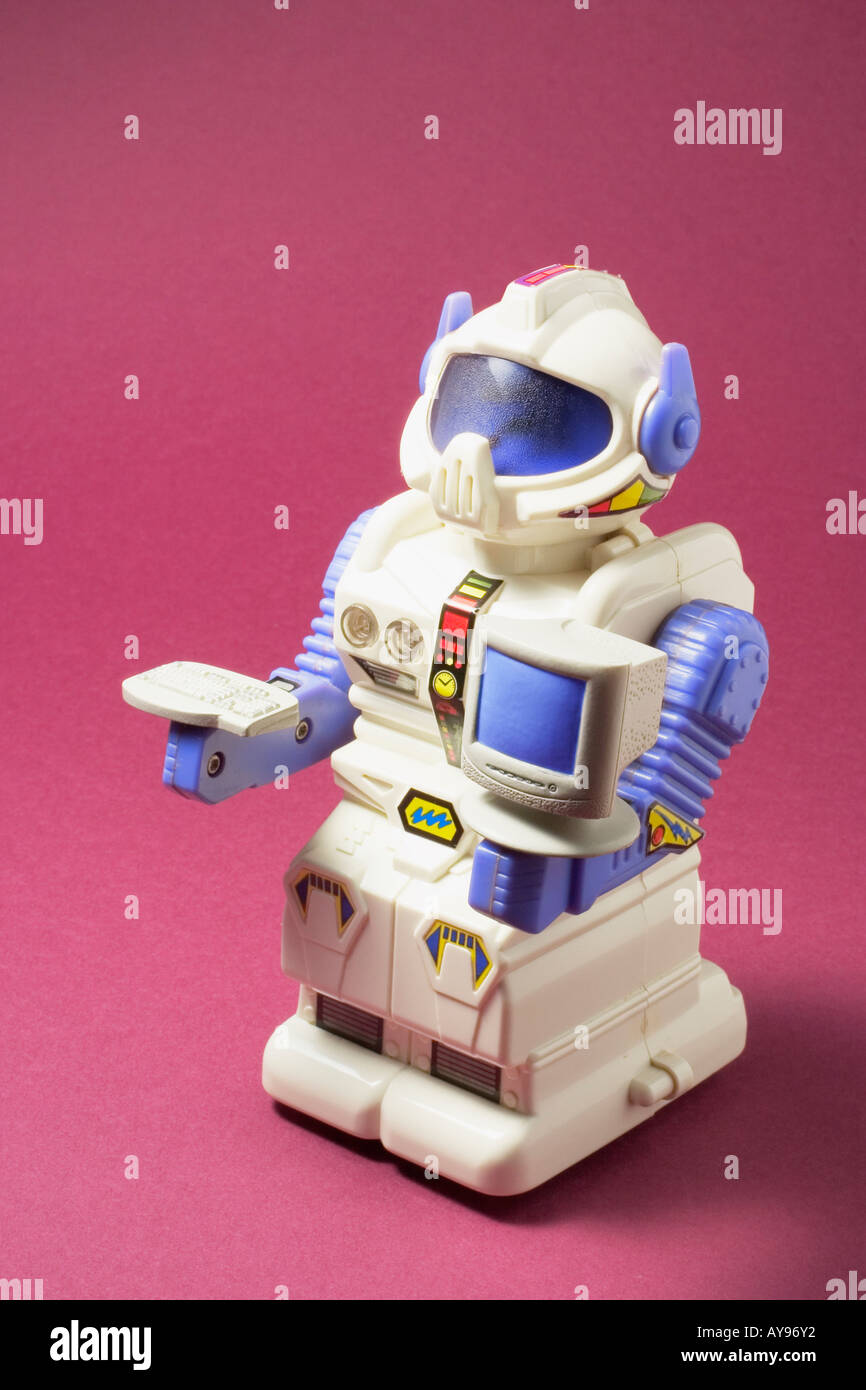Toy Robot with Miniature Computer Stock Photo - Alamy