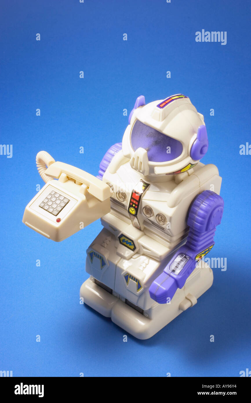 Toy Robot with Miniature Phone Stock Photo - Alamy
