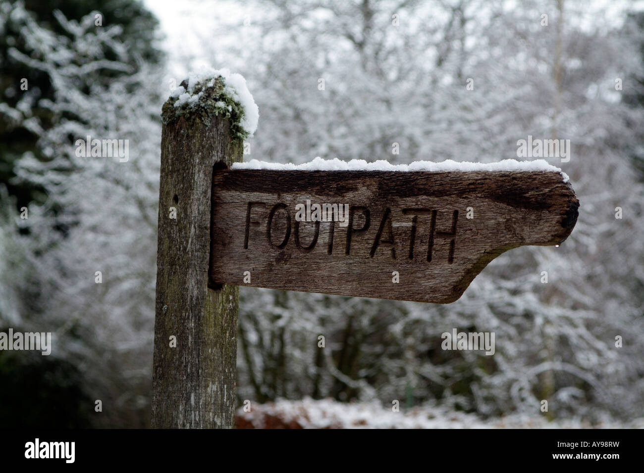Footpath Wooden Sign Covered in Snow Stock Photo - Alamy