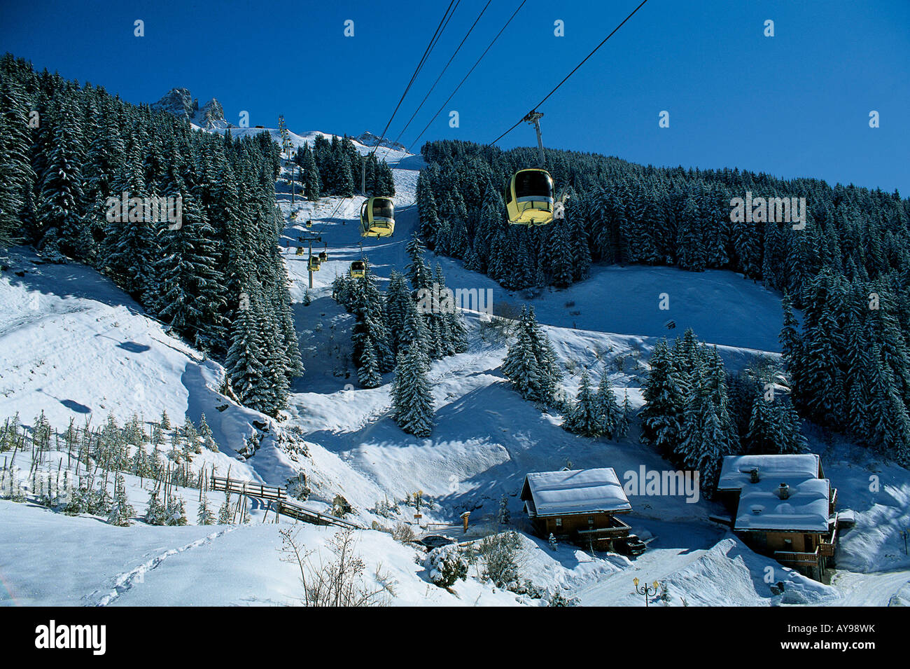 Chair lift and rooftops in Meribel mountain resort, France Stock Photo ...