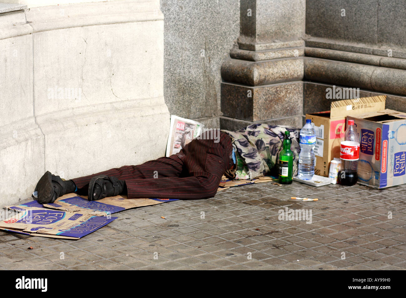 A homeless person sleeps on the streets in Barcelona, Spain Stock Photo ...