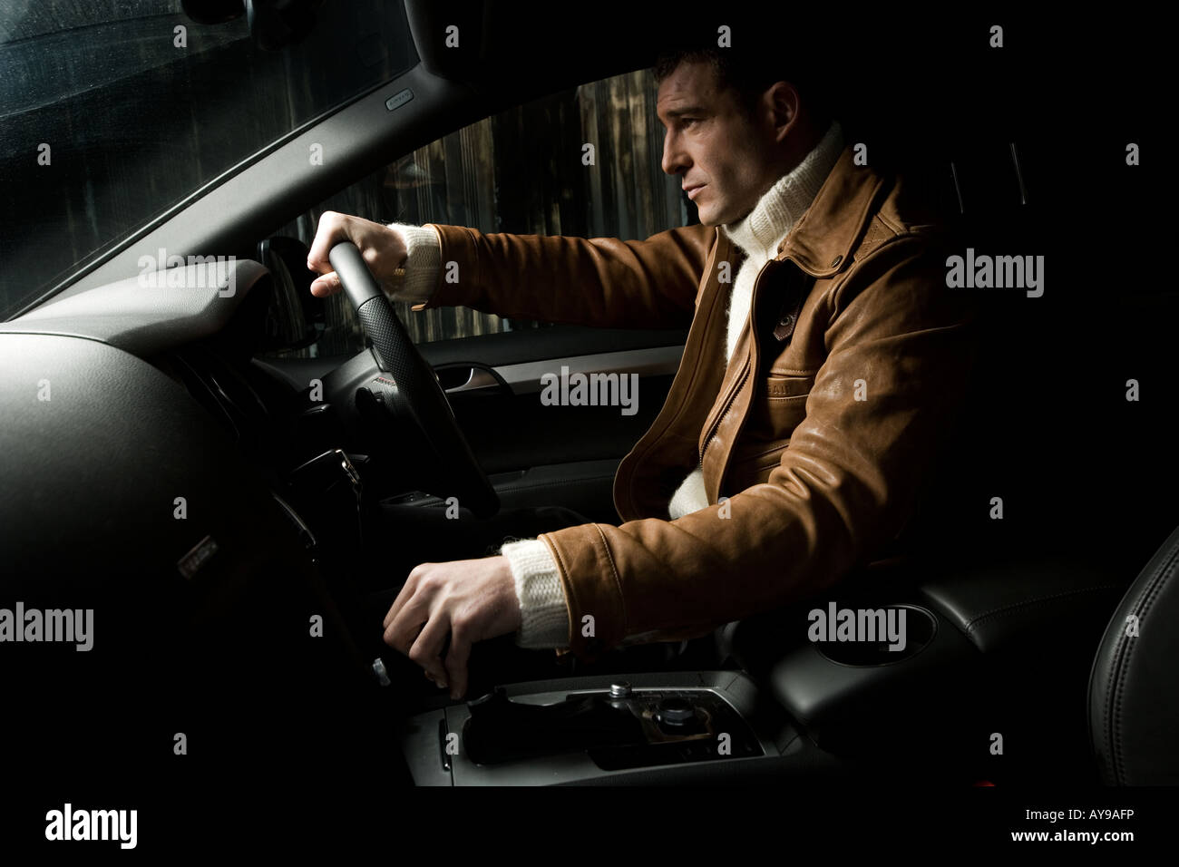 MAN DRIVING AUDI Q7 Stock Photo - Alamy
