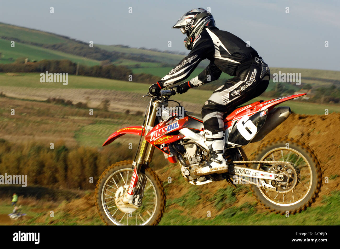 a guy rider on a motocross bile motorcycle jumping and racing big air ...