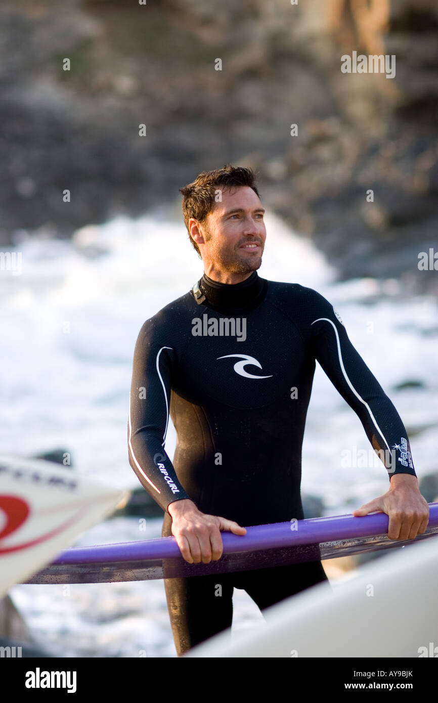 Surfer Gary Green with board and wetsuit, Cornwall, UK Stock Photo - Alamy