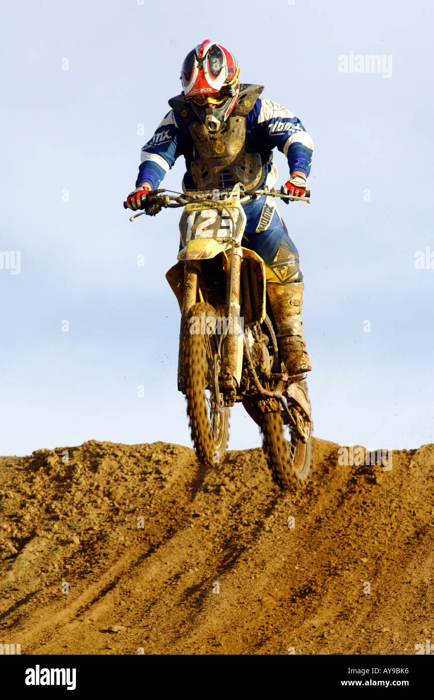 a guy rider on a motocross bile motorcycle jumping and racing big air ...