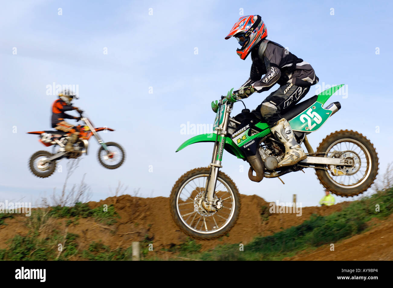 a guy rider on a motocross bile motorcycle jumping and racing big air ...