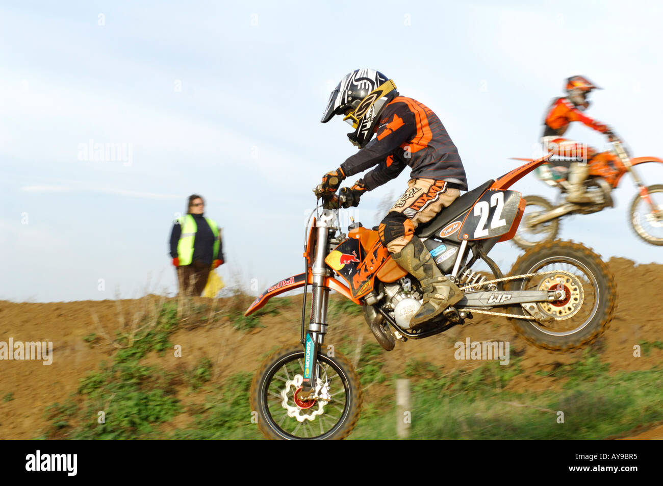 a guy rider on a motocross bile motorcycle jumping and racing big air ...
