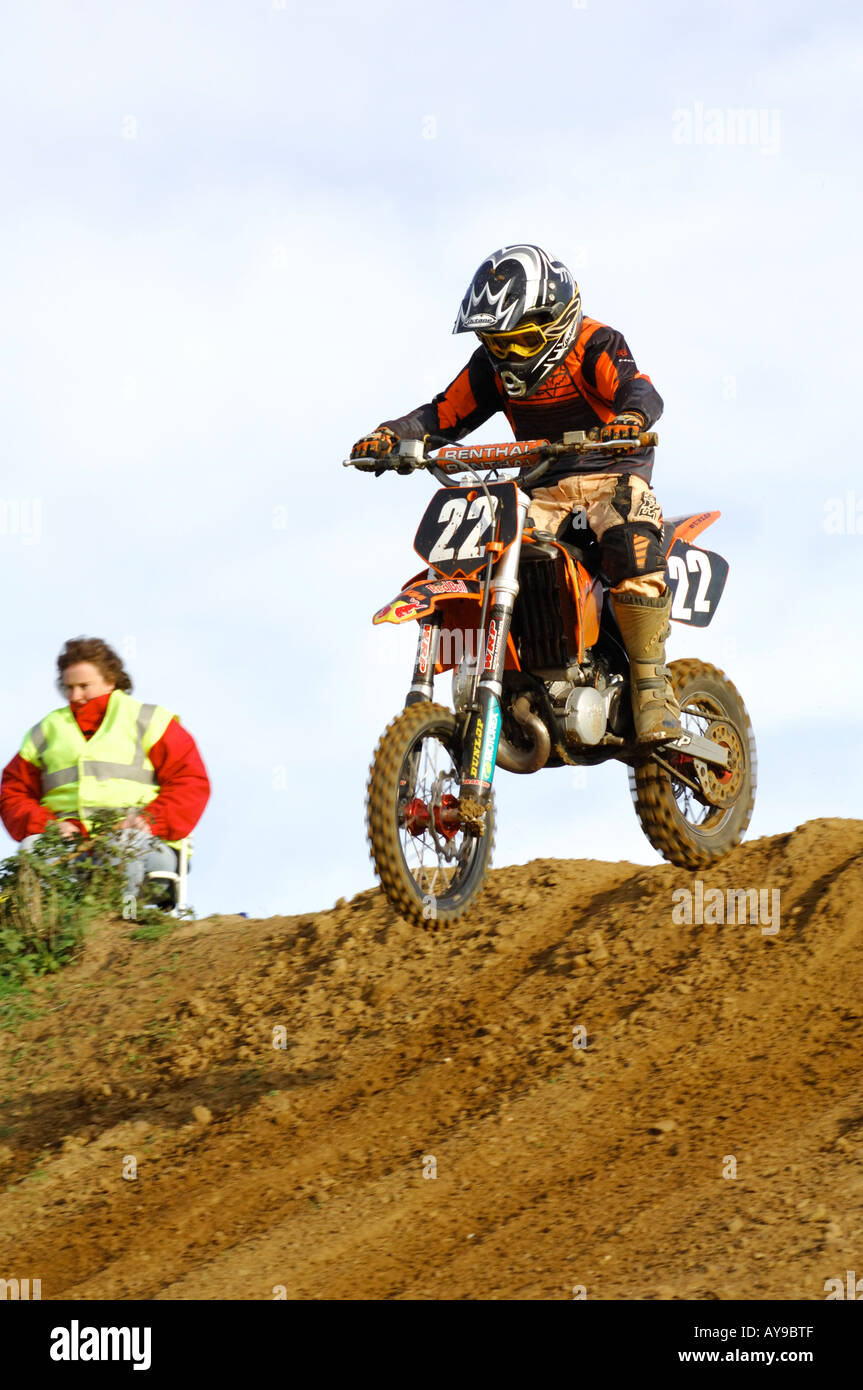 a guy rider on a motocross bile motorcycle jumping and racing big air ...