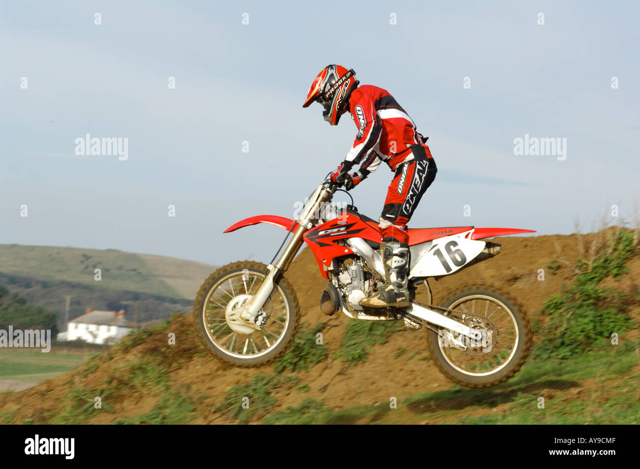 a guy rider on a motocross bile motorcycle jumping and racing big air ...