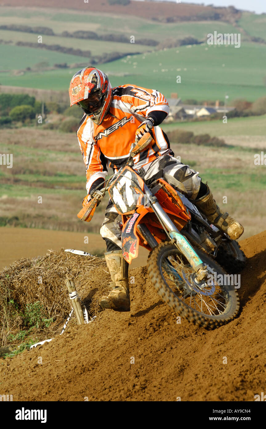 a guy rider on a motocross bile motorcycle jumping and racing big air ...