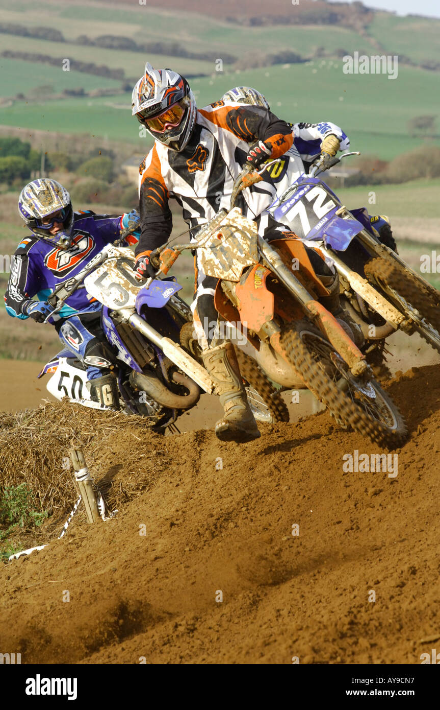 a guy rider on a motocross bile motorcycle jumping and racing big air ...