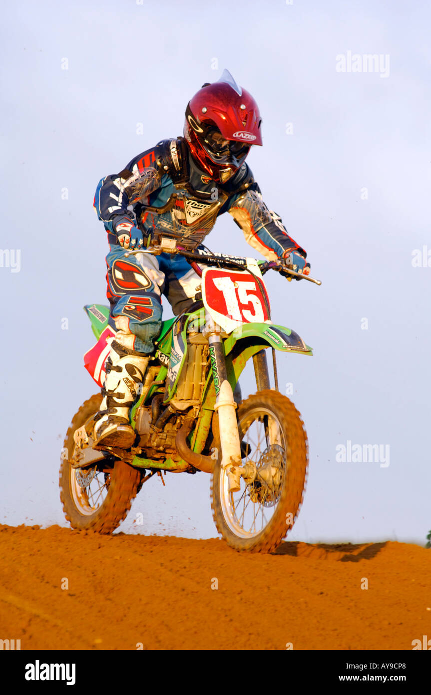 a guy rider on a motocross bile motorcycle jumping and racing big air ...