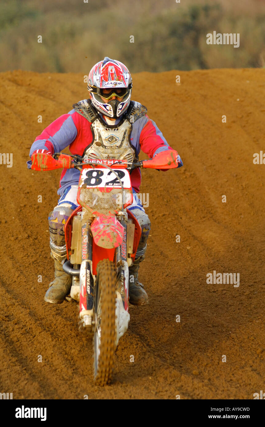 a guy rider on a motocross bile motorcycle jumping and racing big air ...