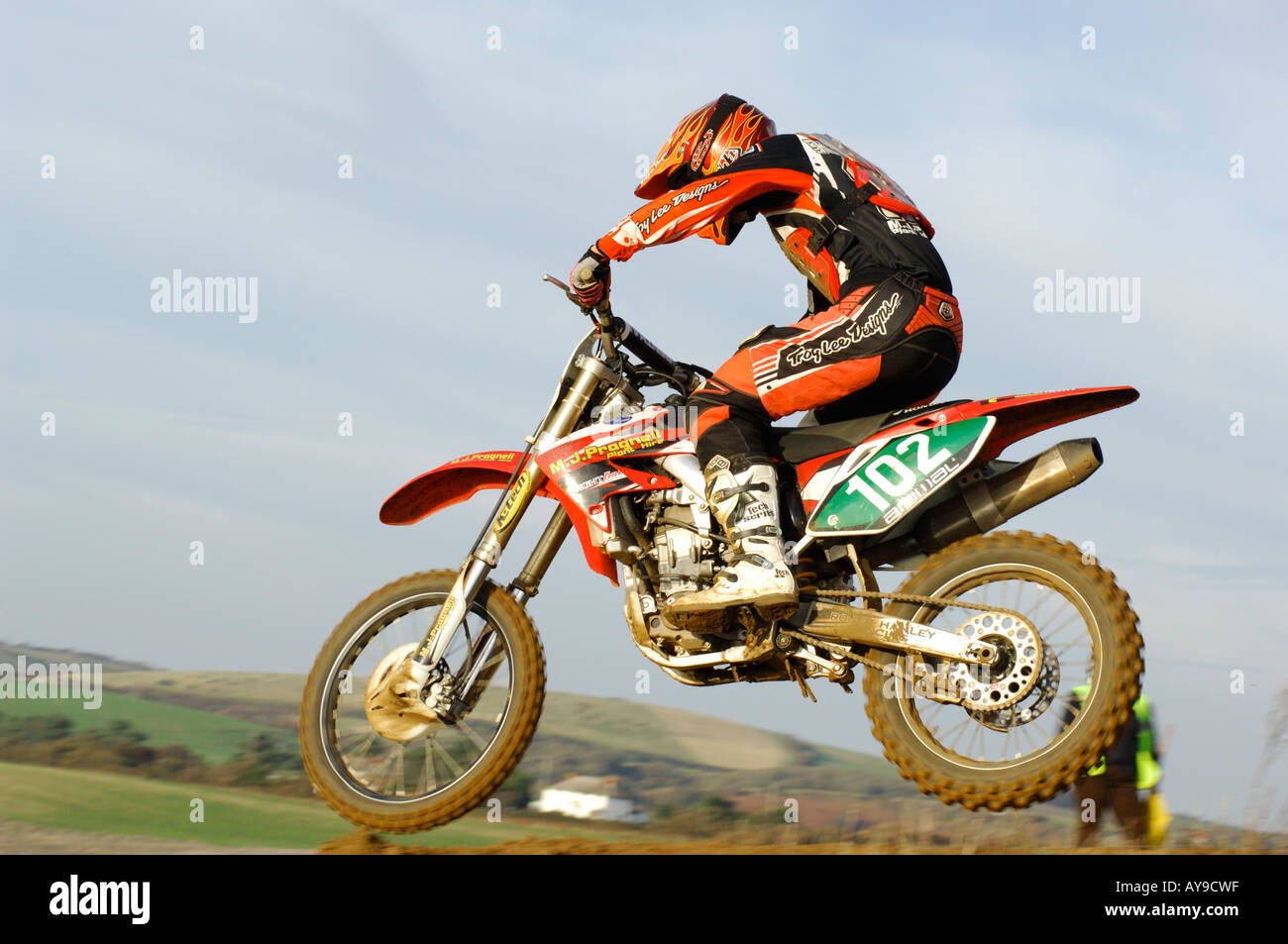 a guy rider on a motocross bile motorcycle jumping and racing big air ...