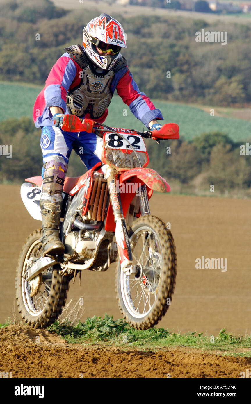 a guy rider on a motocross bile motorcycle jumping and racing big air ...